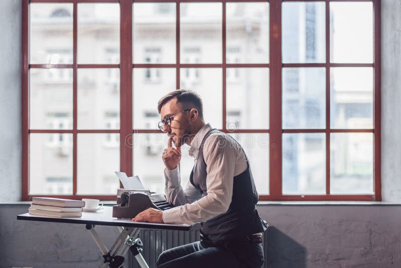 Thinking Writer with a Retro Typewriter Stock Image - Image of ...