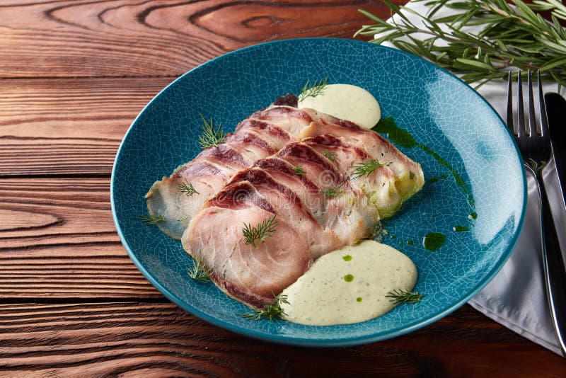 Thinly Sliced Fish Fillet with Sauce Stock Photo - Image of herbs ...