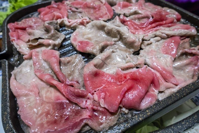 Thinly Sliced Pieces of Beef in the Process of Being Fried on a Hot ...