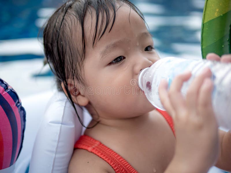 Thirsty Kid Girl Refreshing Herself and Drinking Water Form Plastic ...