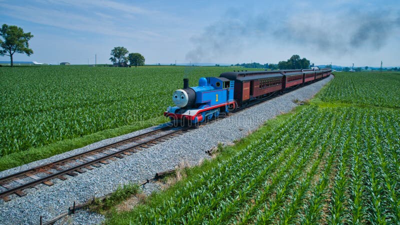 Thomas the Tank Engine Pulling Passenger Cars and Blowing Smoke on a ...