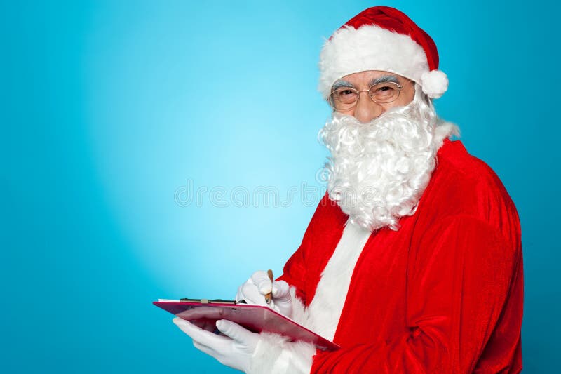 A Thoroughly Modern Santa Claus Checks His List Stock Image - Image of ...