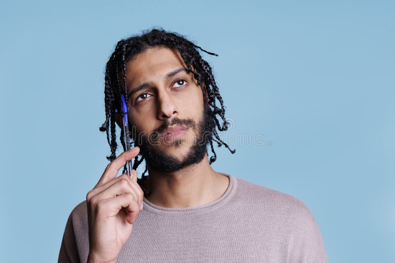 Thoughtful Arab Man Making Decision with Pensive Facial Expression ...