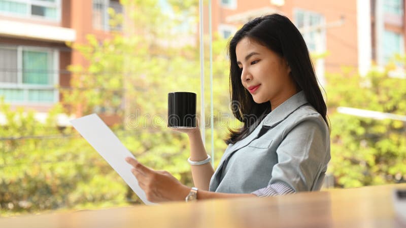 Thoughtful Asian Woman Small Business Entrepreneur Checking Working Schedule Plan in Diary Stock ...