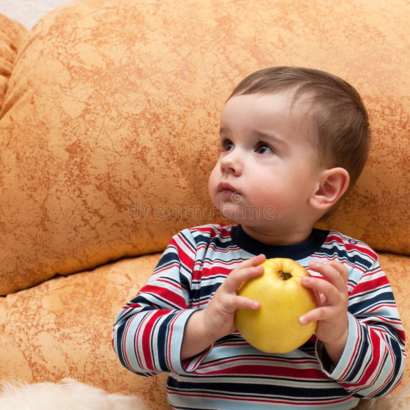 Thoughtful baby with apple stock image. Image of innocence - 12373459