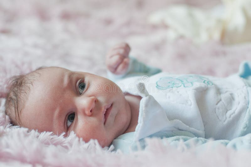 Thoughtful Baby Indoor in Blue Cloth Stock Photo - Image of closeup ...