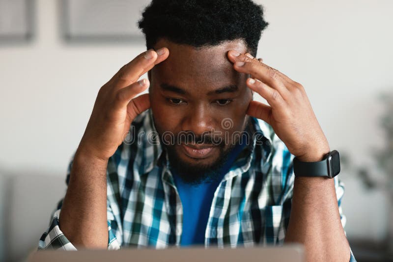 Thoughtful Black Guy Using Laptop Having Business Problems at Workplace ...