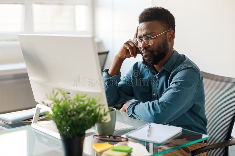 Thoughtful Black Male Ceo Working on Computer in Office, Sitting at ...