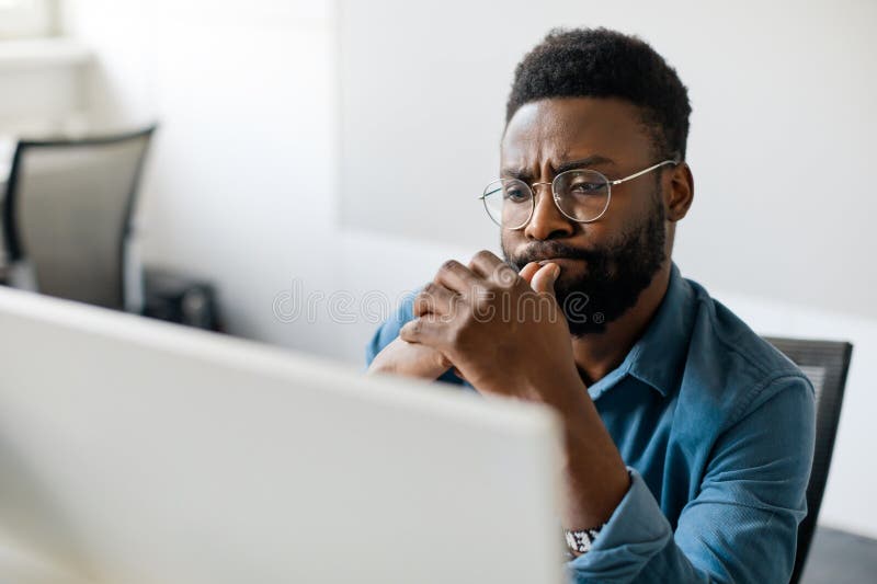 Thoughtful Black Man in Eyeglasses Stack with Hard Task, Looking at ...