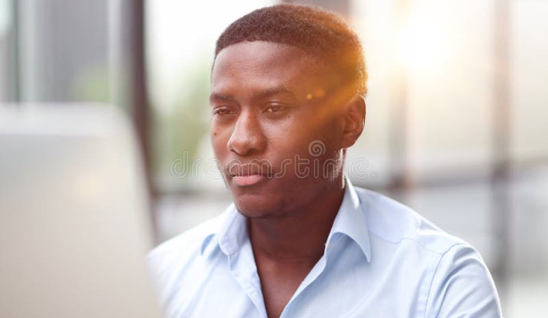 African American Man Sitting on Desk and Posing with Folded Hands Stock ...