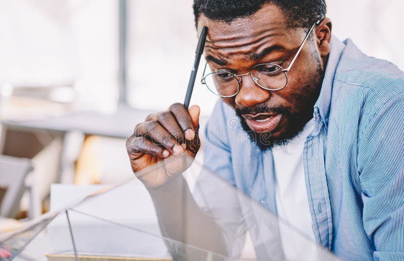 Thoughtful Black Man Staring at Glass Terrarium in Office Stock Image ...