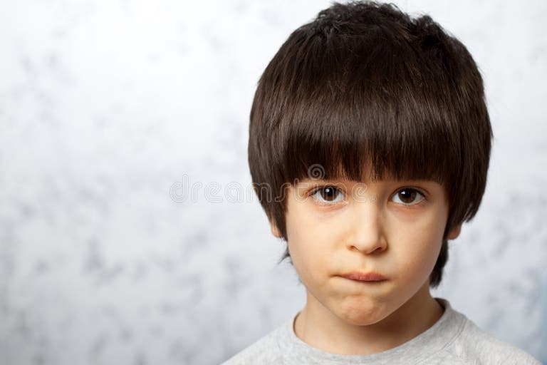 Thoughtful boy bit his lip stock image. Image of closeup - 29455557