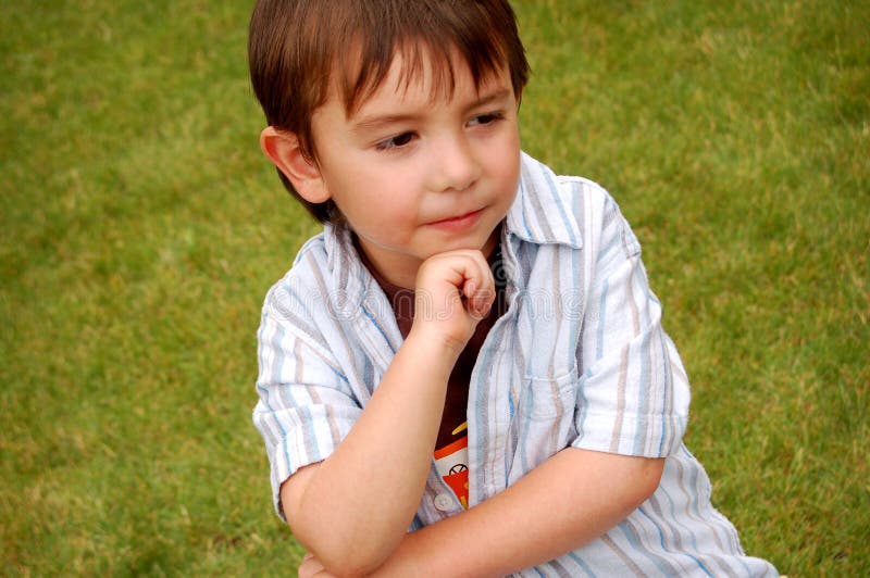 Thoughtful boy outdoors stock image. Image of thinks - 12450203