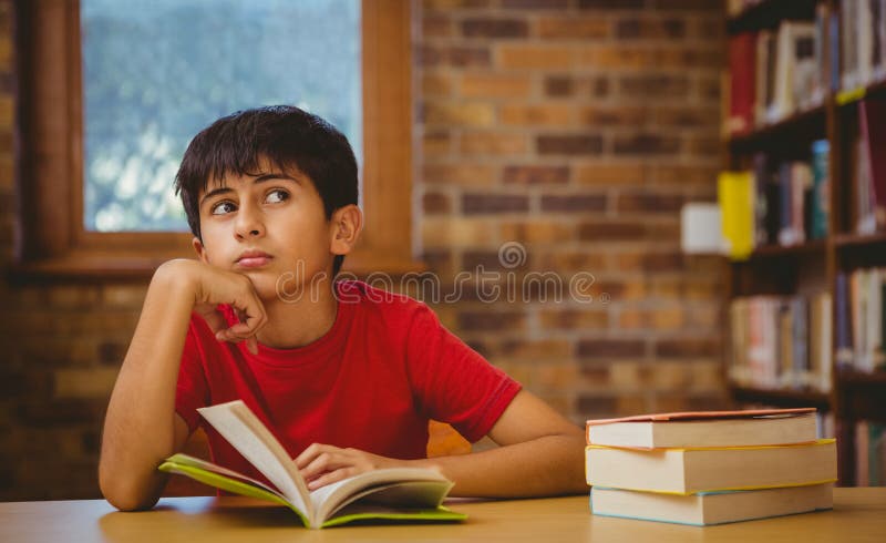 Thoughtful Boy Reading Book in Library Stock Image - Image of cute ...