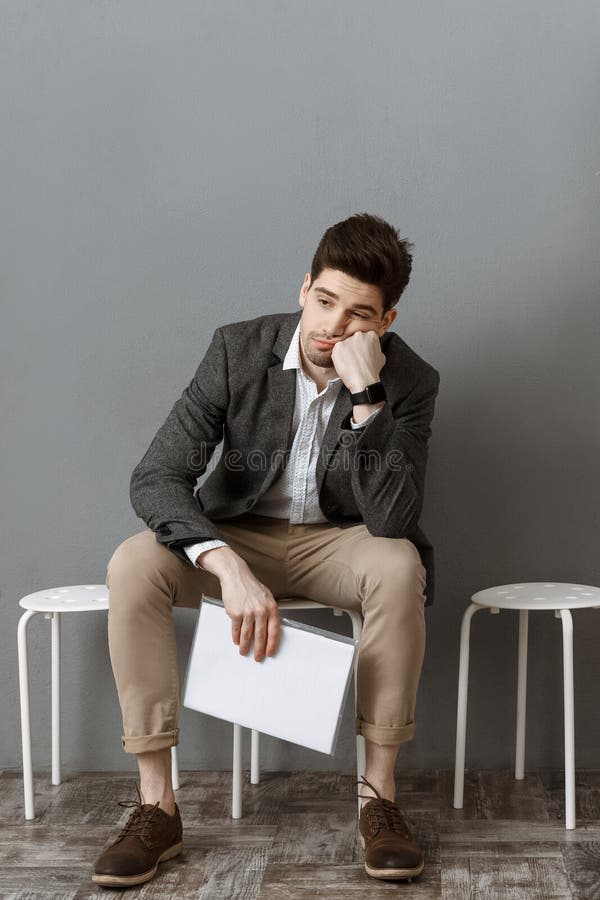 Thoughtful Businessman with Documents Waiting for Job Interview Stock ...