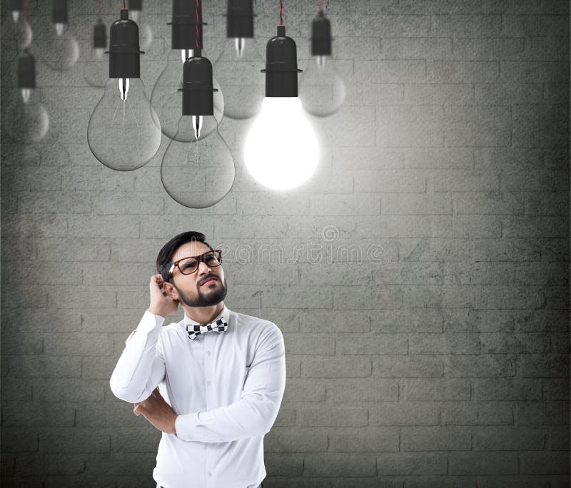 Thoughtful Businessman Looking at Light Bulb Stock Image - Image of ...