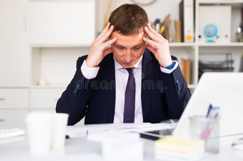 Thoughtful Businessman Working Alone in Office Stock Image - Image of ...