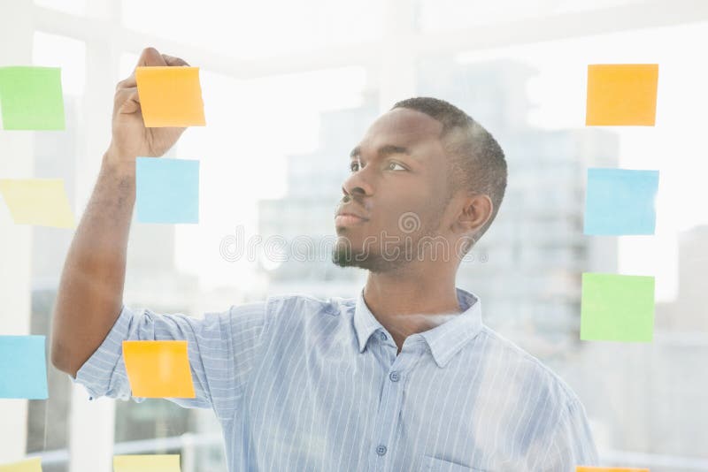 Thoughtful Businessman Writing Sticky Notes Window Stock Photos - Free ...