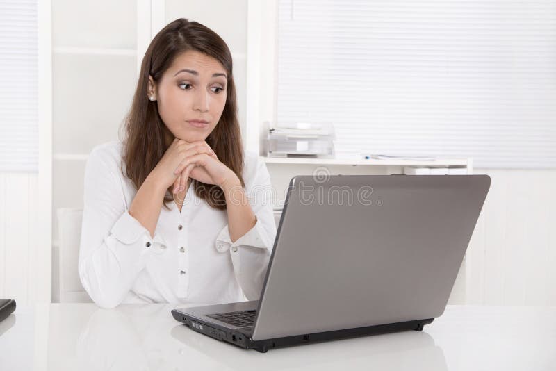 Thoughtful Businesswoman in Front of Her Computer at Office. Stock ...