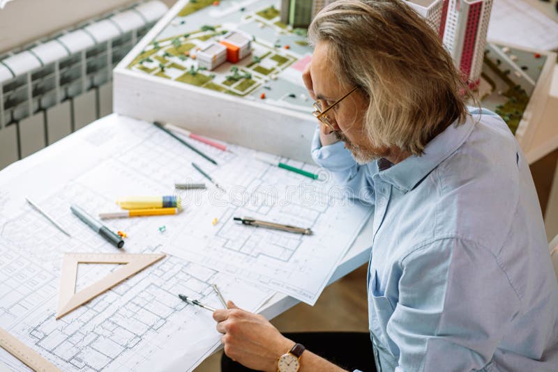 Thoughtful Mature Architect Working in Office Stock Photo - Image of ...