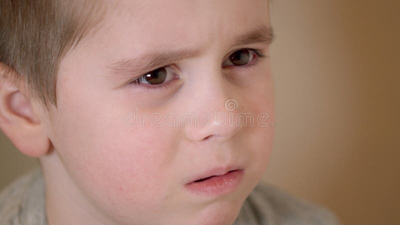 A Thoughtful Child Portrait Featuring a Captivating and Intense ...