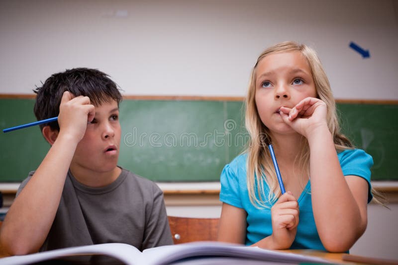 Thoughtful Children Working Together Stock Image - Image of elementary ...