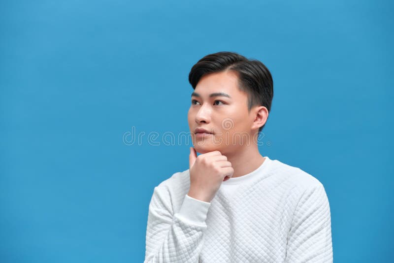 Thoughtful Complicated Asian Man in Shirt, Touching Chin and Looking ...