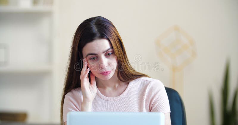Thoughtful Concerned Attractive Woman Working on Laptop Computer ...