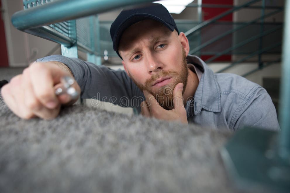 Thoughtful Craftsman Thinking about Carpet Stock Photo - Image of safe, cutterknife: 288845486