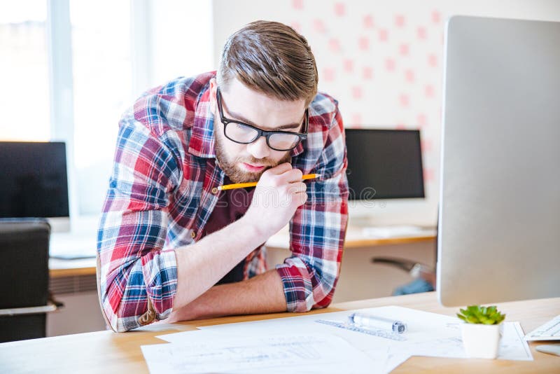 Thoughtful Creative Man Designing Project and Making Blueprint Stock ...