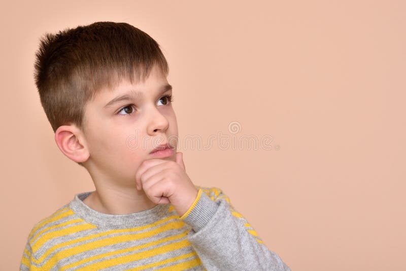 Thoughtful cute young boy stock image. Image of looking - 84770085