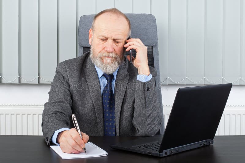 Thoughtful Employer Having a Phone Call Stock Photo - Image of ...