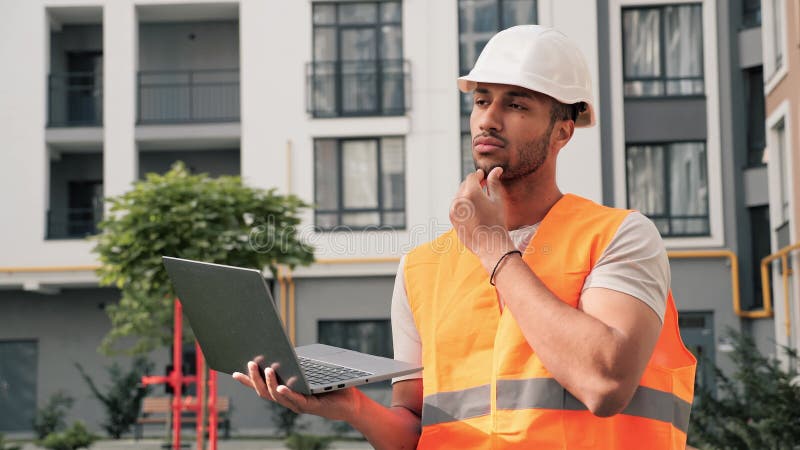 Thoughtful Engineer with Blueprints Roll Raises Index Finger Stock ...