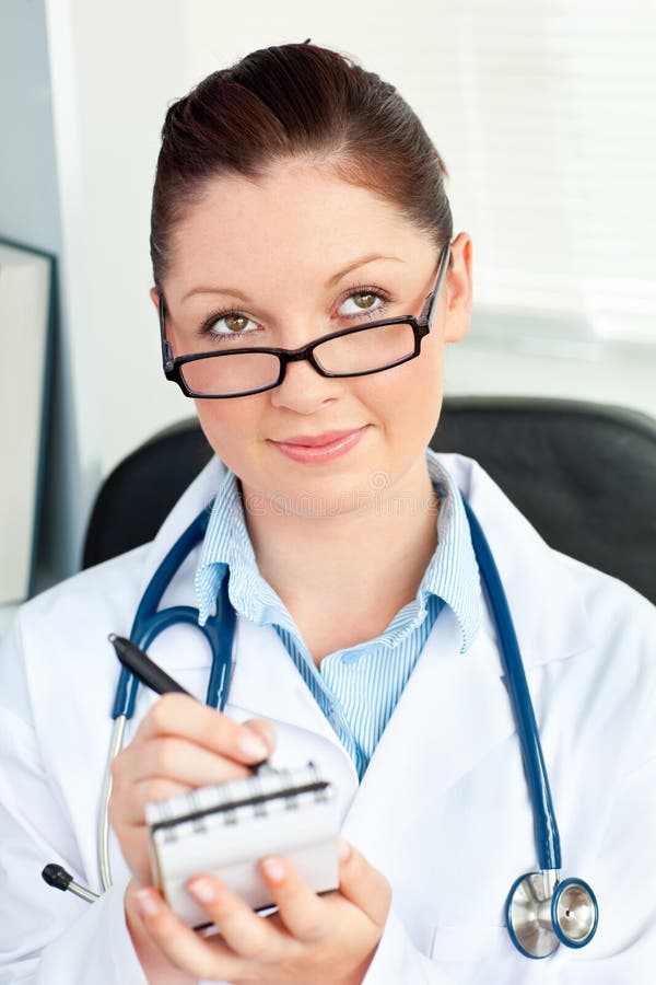Thoughtful Female Doctor Taking Notes Stock Photo - Image of occupation ...