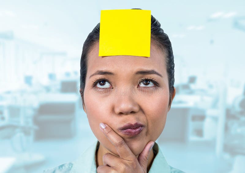 Thoughtful Female Executive with Sticky Note on Head in Office Stock ...