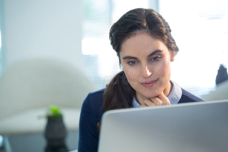 Thoughtful Female Executive Working on Computer Stock Image - Image of ...