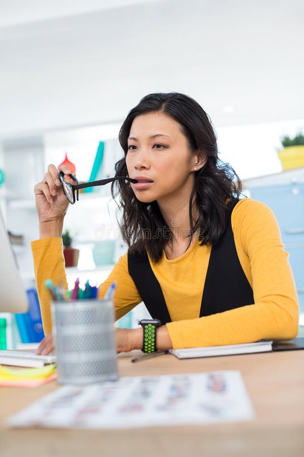 Female Executive Working at Desk in Office Stock Image - Image of ...