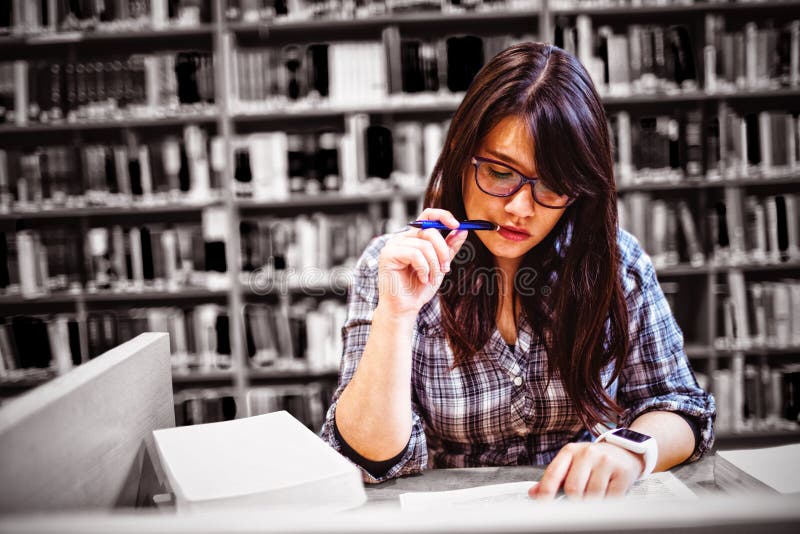 Female Student Looking at Notes in Library Stock Image - Image of learn ...