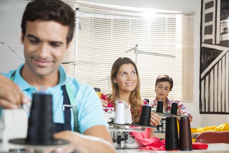 Thoughtful Female Tailor Sitting at Workbench Stock Image - Image of ...