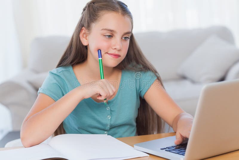 Thoughtful Girl Doing Her Homework Stock Photo - Image of education ...