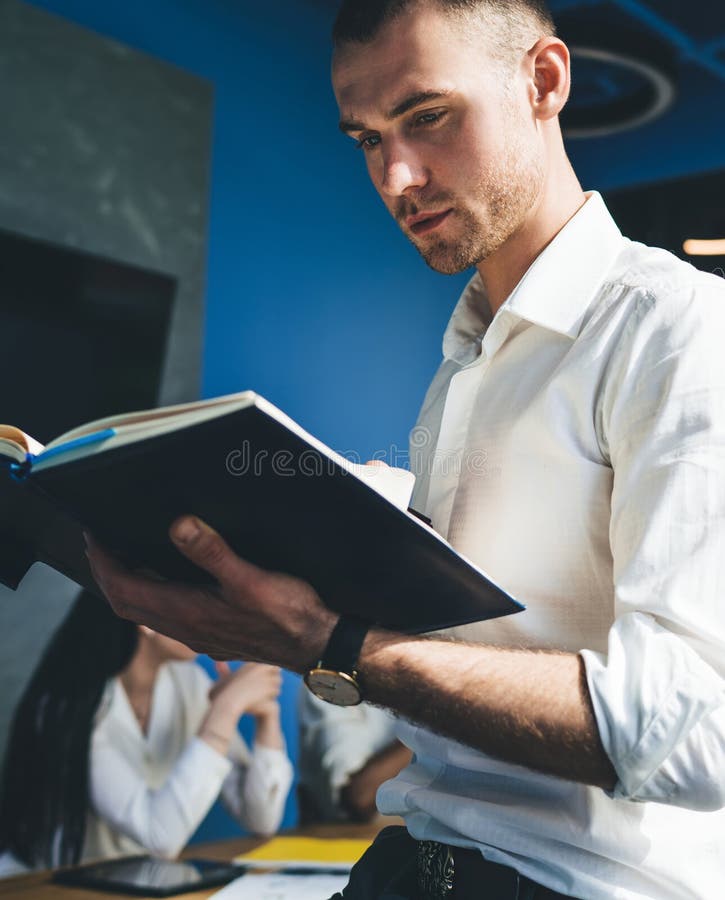 Thoughtful Guy Reading Report in Office Stock Photo - Image of formal ...