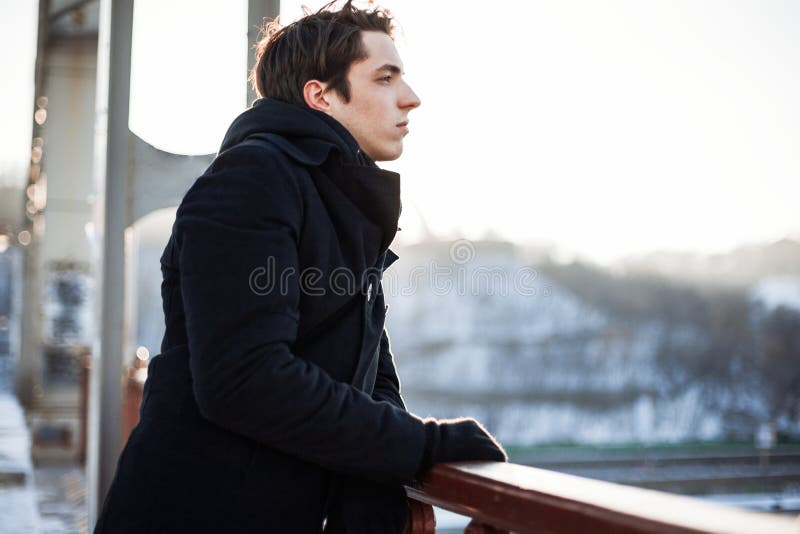 Thoughtful Guy Standing on the Bridge Stock Image - Image of overcoat ...