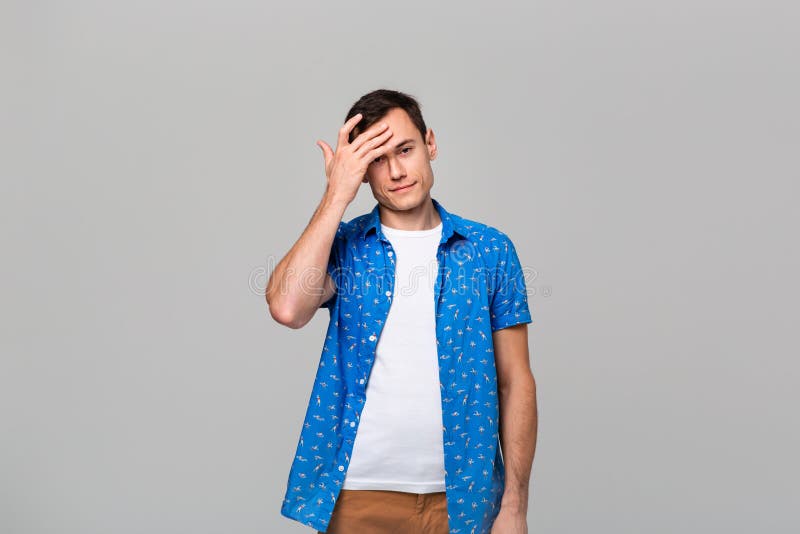 Thoughtful Handsome Man Looking at the Camera Holding Hand Close To ...