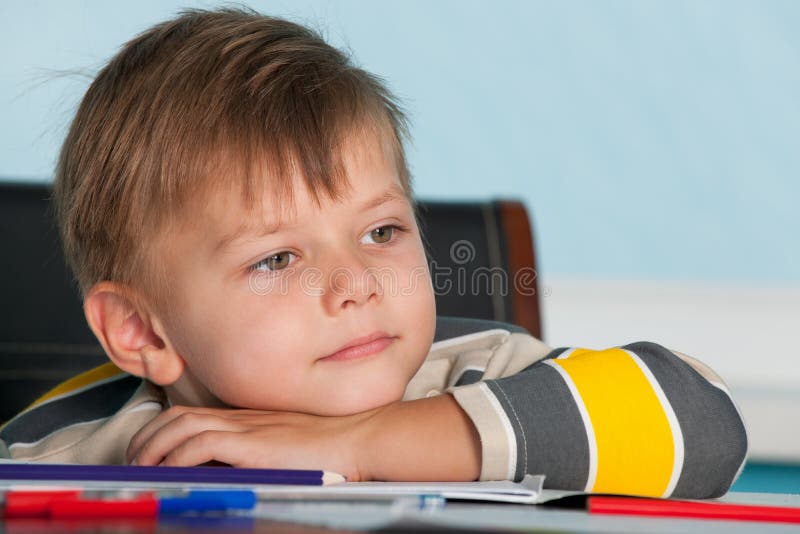 A Thoughtful Little Boy at the Desk Stock Photo - Image of handsome ...