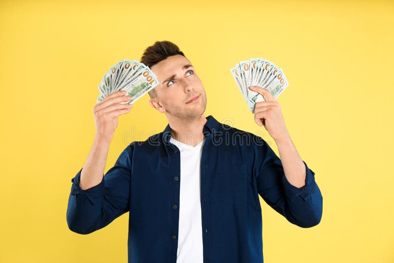 Thoughtful Man with Cash Money on Yellow Background Stock Image - Image ...