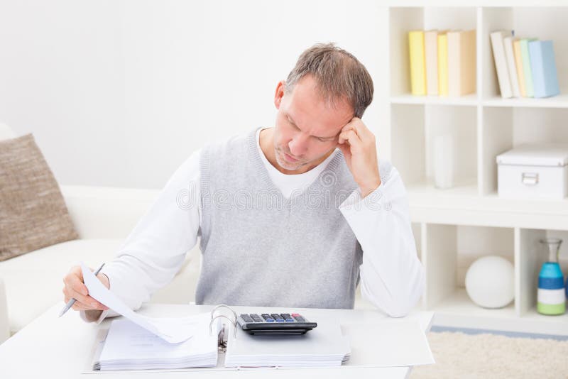 Thoughtful Man Holding Calculator Stock Image - Image of bill, head ...