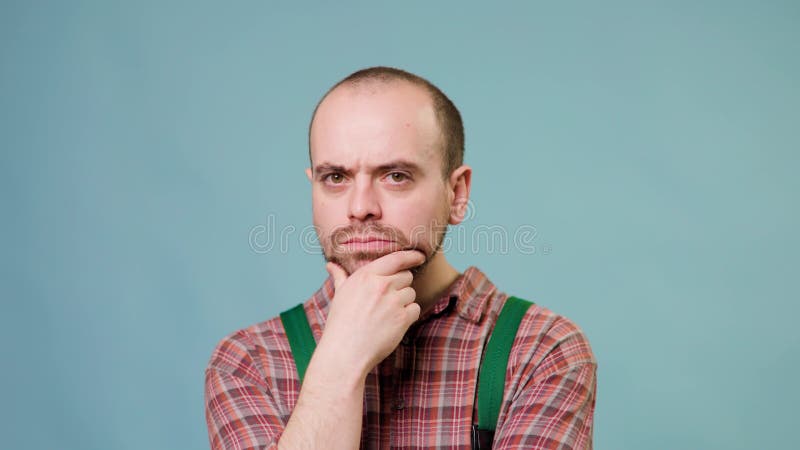 Thoughtful Man Pensive Workman in Overalls Looking at Camera, Stock ...