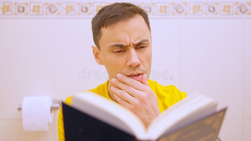 Thoughtful Man Reading a Book while Sitting on the Toilet Stock Image ... Thoughtful Man Reading a Book while Sitting on the Toilet Stock Image ...
