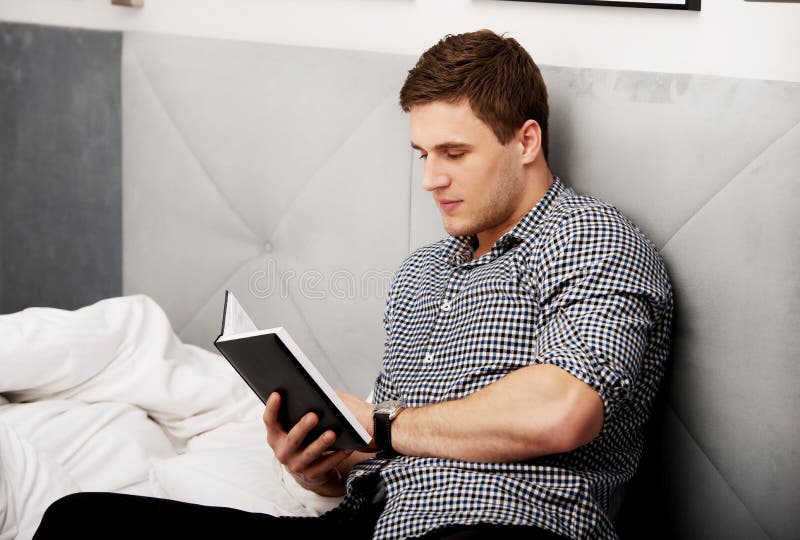 Thoughtful Man Reading A Note In His Bed. Stock Photo - Image of ...