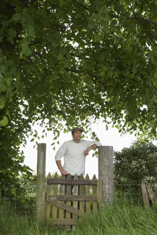 Thoughtful Man Standing Across Field Gate Stock Photo - Image of ...